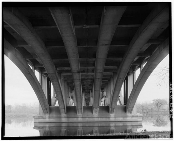Bridge underside. View to east from west river bank.