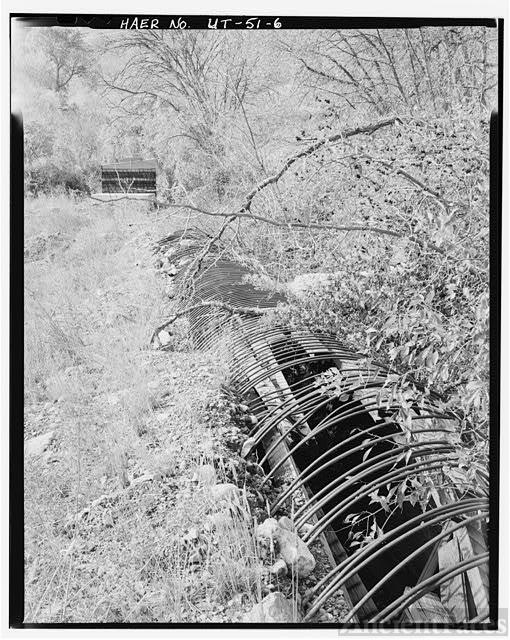 6. Collapsed and abandoned section of wood stave pipe,...