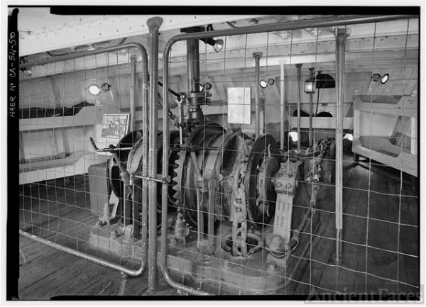 58. View of windlass, looking forward (cage is a museum...