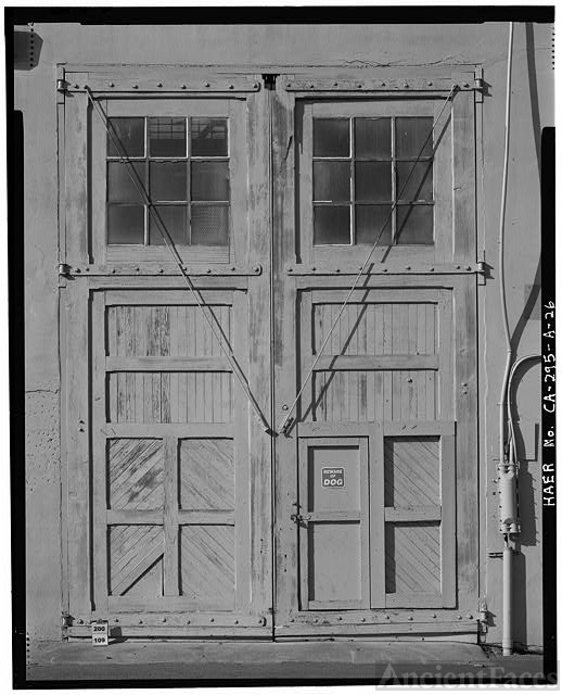 26. DETAIL OF TALL HINGED DOORS AT NORTH END OF EAST...