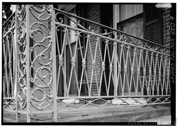 9. Wrought iron and cast iron porch railing and column,...