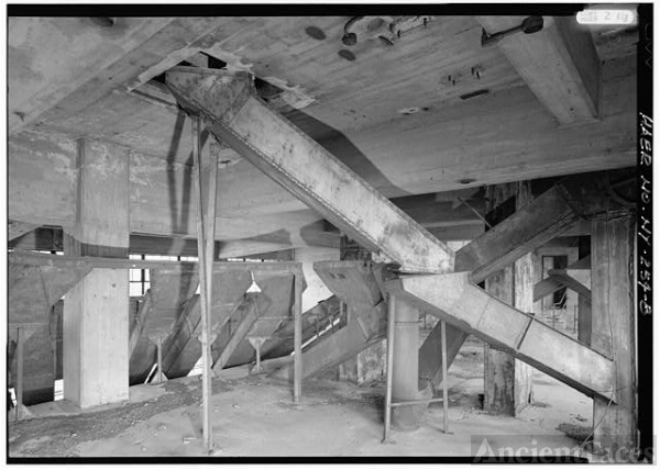 8. Interior view, distribution chutes below garner tanks....