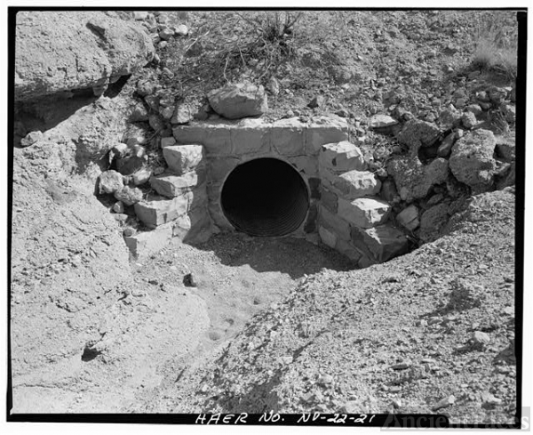 Upstream headwall, dressed stone, vertical winged, facing...