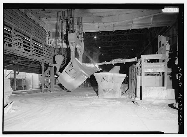 7. INTERIOR VIEW WITH SLAG BEING SKIMMED FROM LADLE.