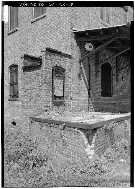3. SOUTHEAST CORNER - Tobacco Redrying Plant, Railroad...