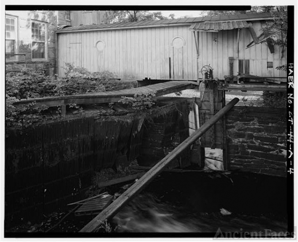 4. VIEW SOUTH OF TRASH RACKS (LEFT) AND SLUICE GATES...