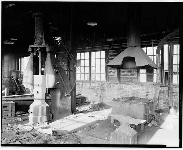 11. Interior view of the blacksmith shop, showing the...