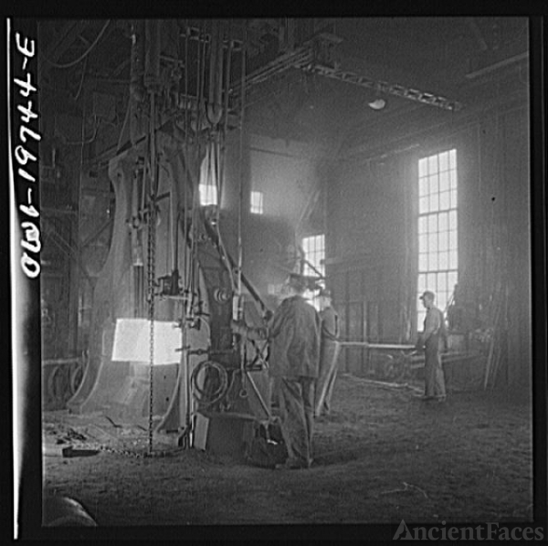 Topeka, Kansas. Hammering out a drawbar at the giant...