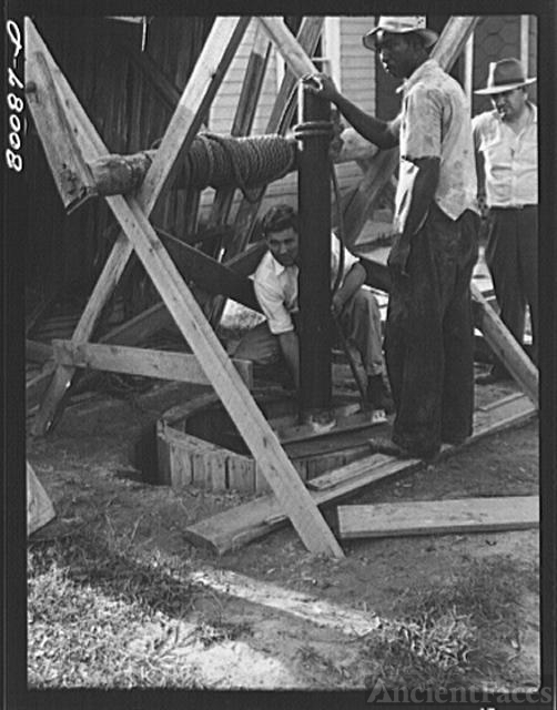 Placing the first piece of casing over the concrete...